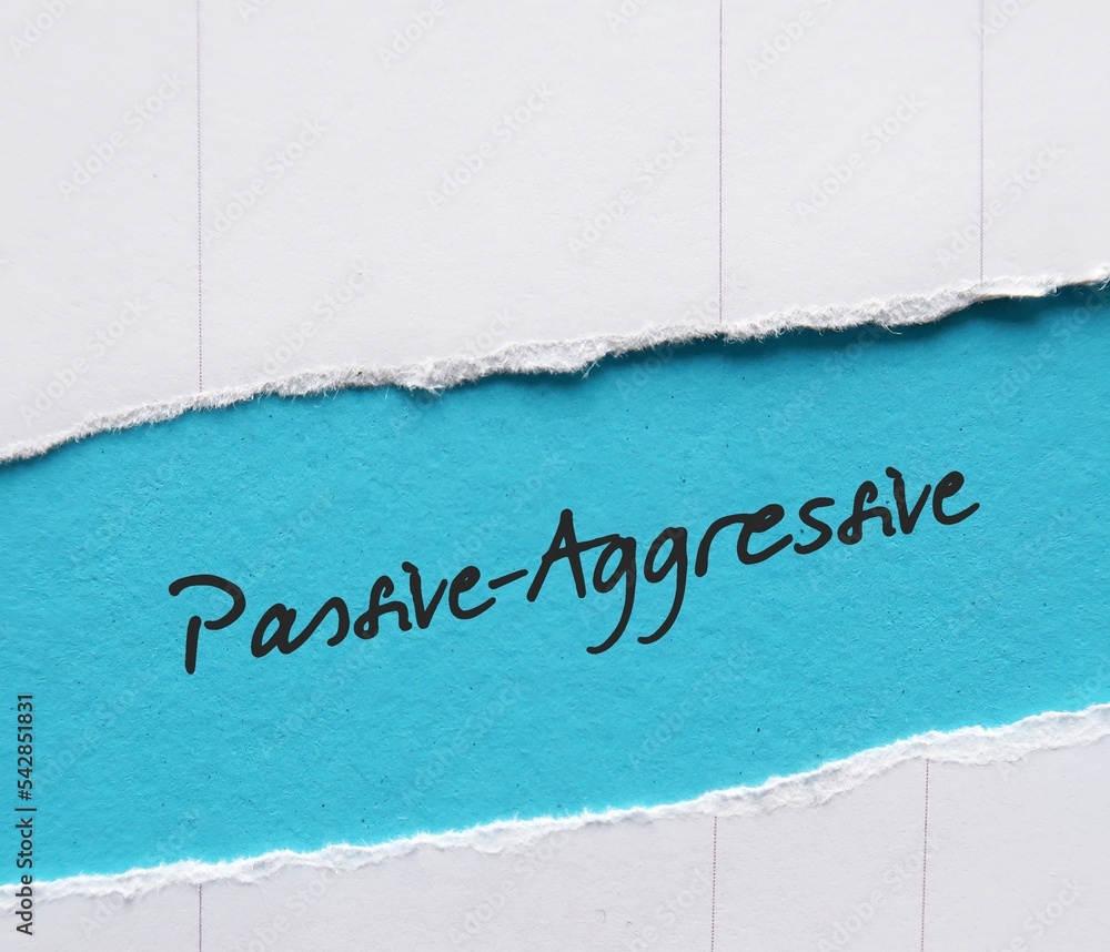 Torn paper on blue background with with handwritten text PASSIVE ...