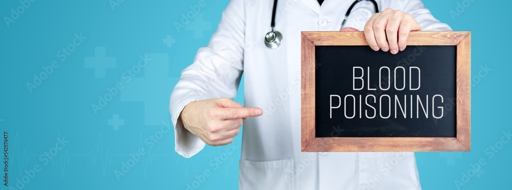 Blood poisoning (sepsis). Doctor shows medical term on a sign/board ...