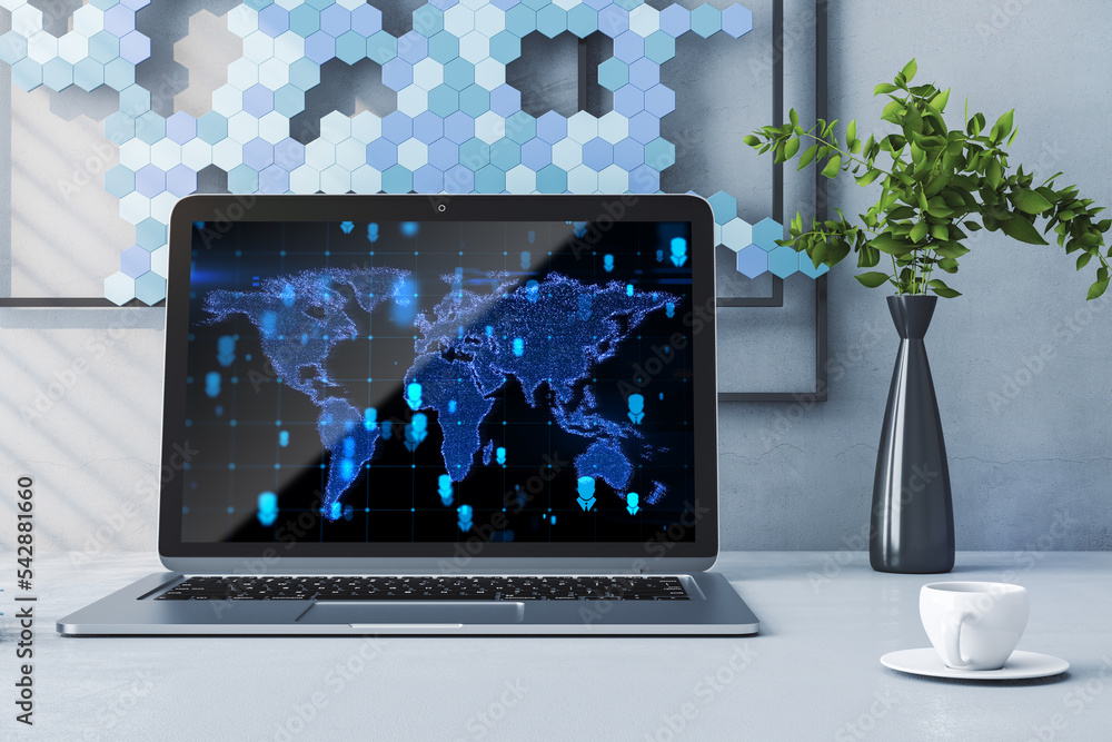 Close up of designer workpace with coffee cup, plant, laptop and ...