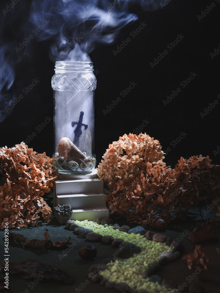 Still life with a silhouette of the sword (excalibur) of King Arthur in ...