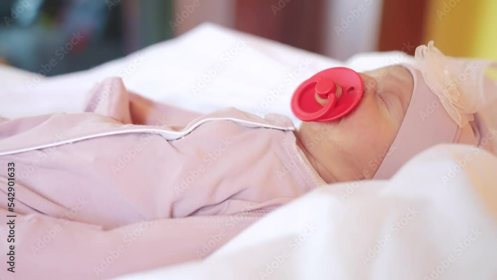 newborn girl baby boy a sleeping with pacifier. maternity hospital ...