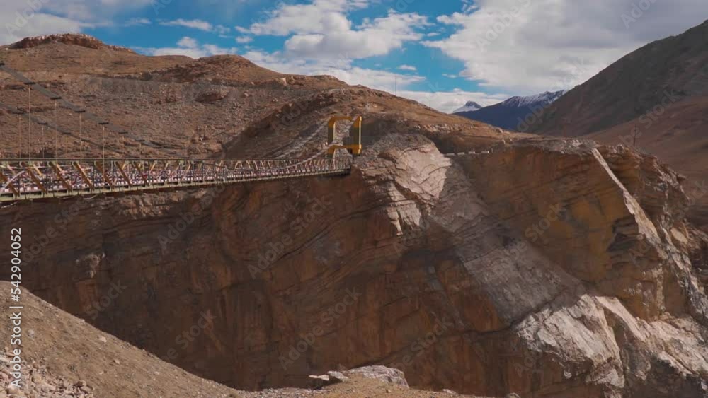 Chicham bridge in background of mountains during sunny day in Kibber ...