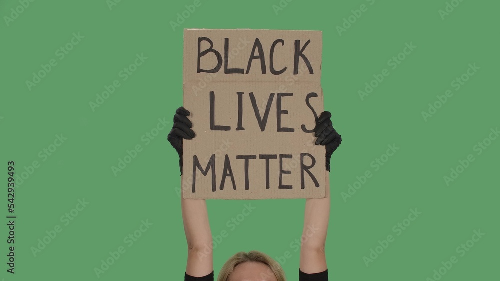 Foto de Hands of an unknown person in black gloves raise cardboard ...