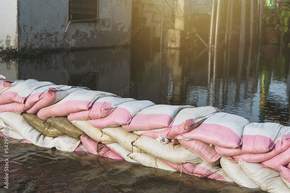 line flood barrier sandbag from the Tha Chin River that overflows in ...