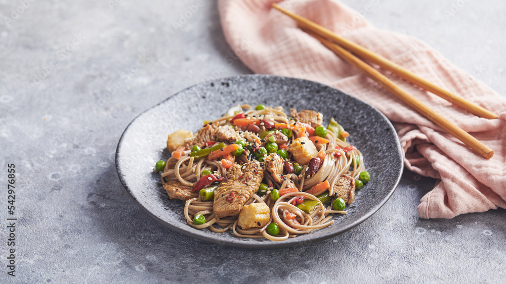 Wok with turkey meat, soba noodles, corn, green peas, green beans and ...