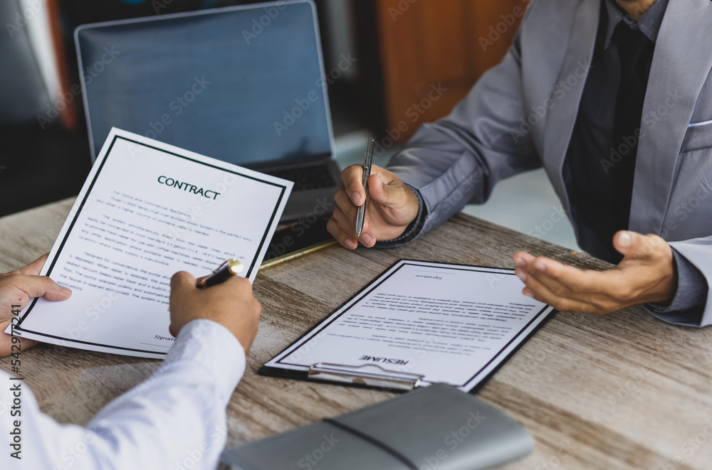 Job interview and signing of employment contract documents. Stock Photo ...