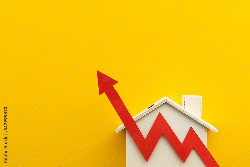 Rising cost of living. Mortgage inflation rates increase. House with a ...