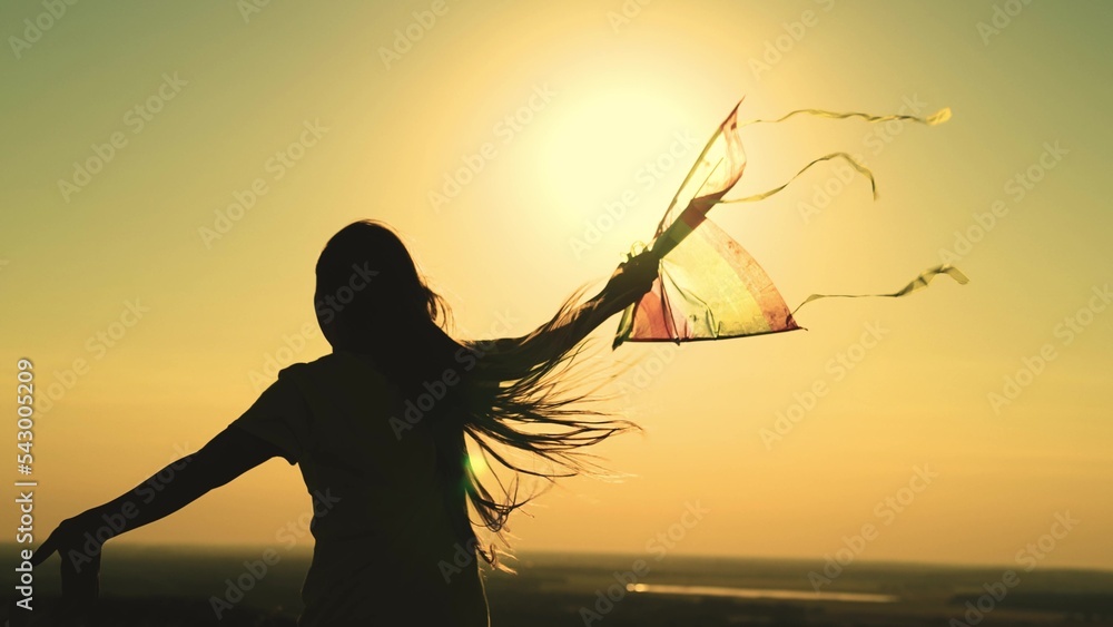 kite. colored rainbow kite hands girl with long hair. happy family ...