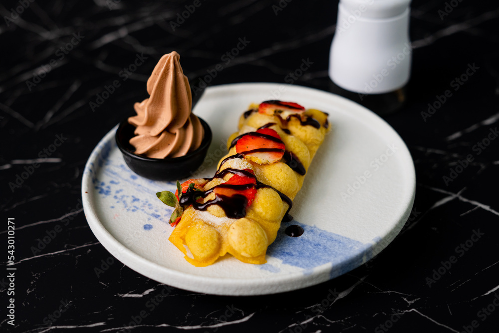 Croffle chocolate strawberry with ice cream on top (a compound word of ...