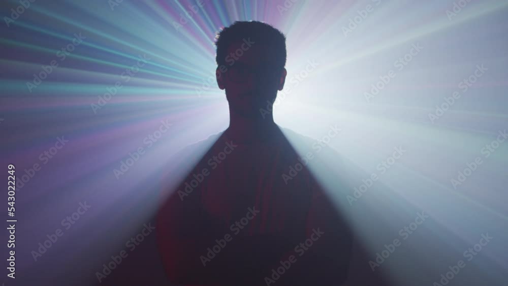 Light rays projected behind a man Stock Video | Adobe Stock
