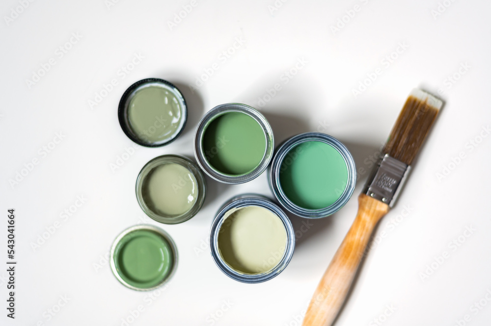 Tiny sample paint cans during house renovation, process of choosing ...