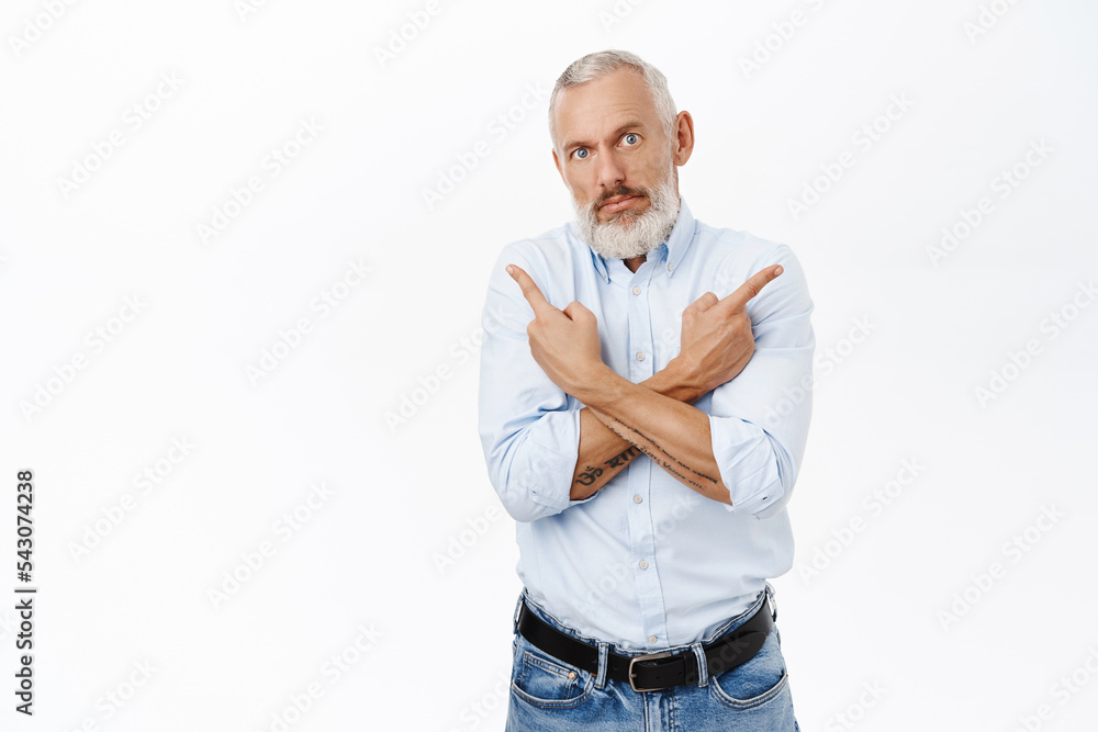 Confused businessman pointing sideways, looking clueless, puzzled to ...