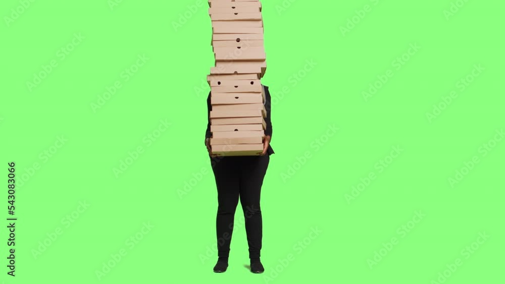 Female courier carrying boxes of pizza in huge pile, standing on full ...