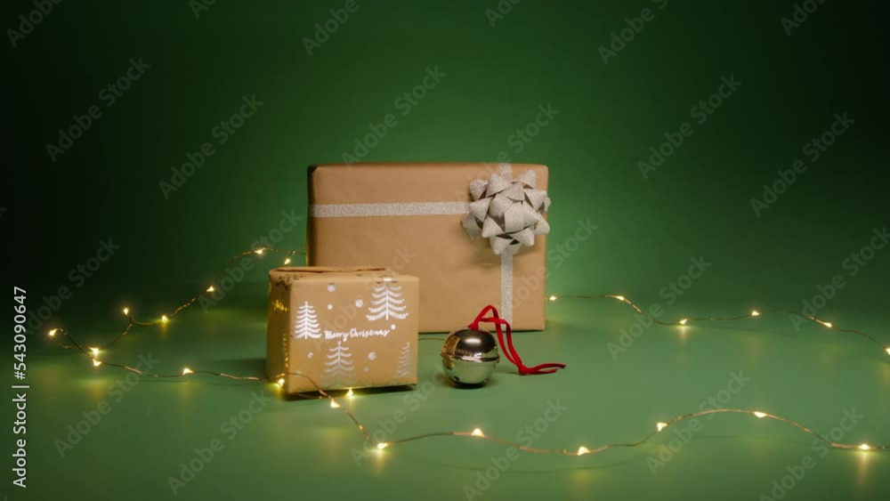 Wideo Stock: Gift boxes wrapped in kraft paper and Santa reindeer bell ...