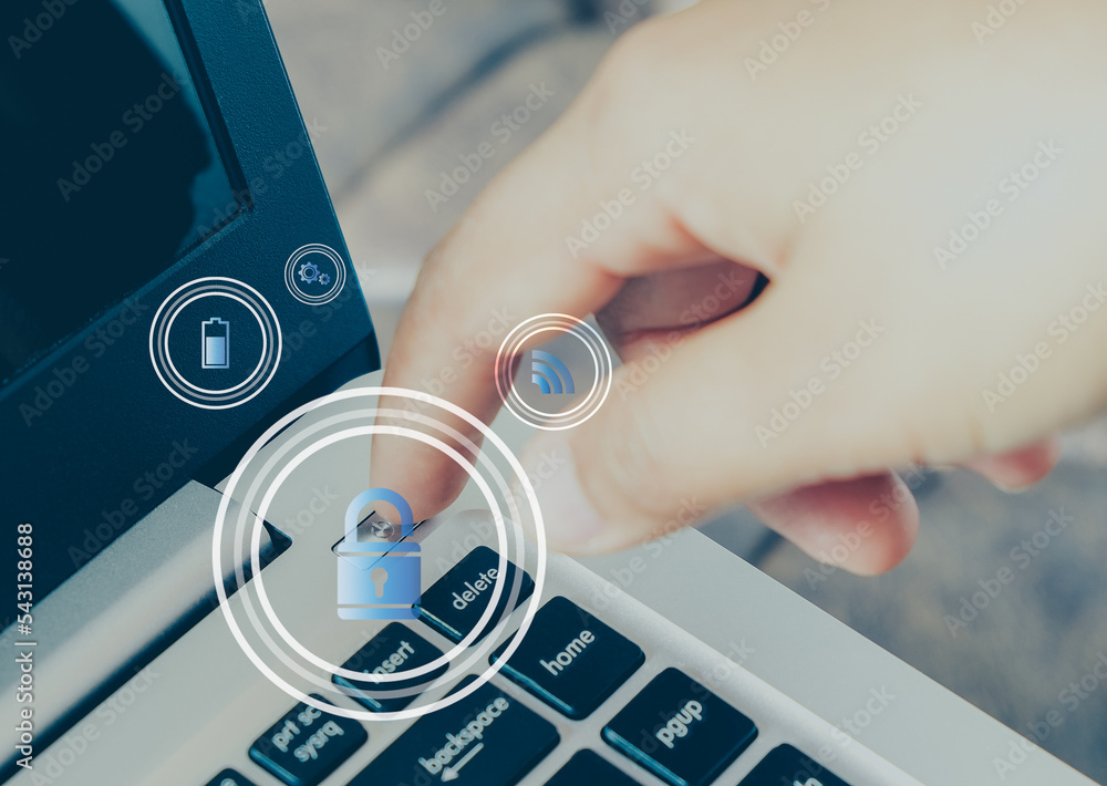 Finger pushing start power button on the laptop computer. Press turn ...