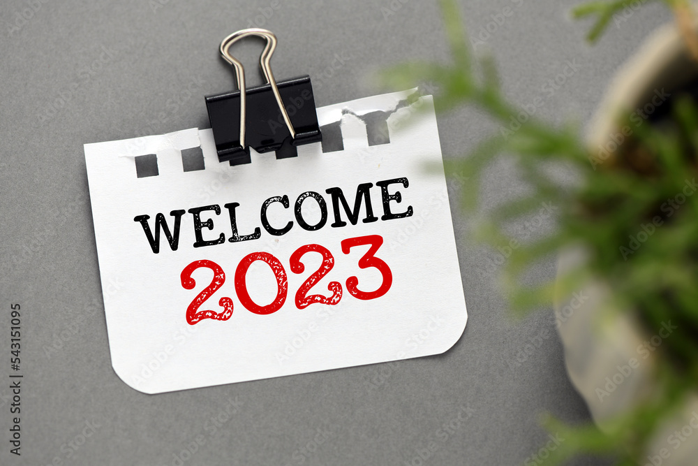 WELCOME 2023 words on a piece of paper and gray background. Stock Photo ...