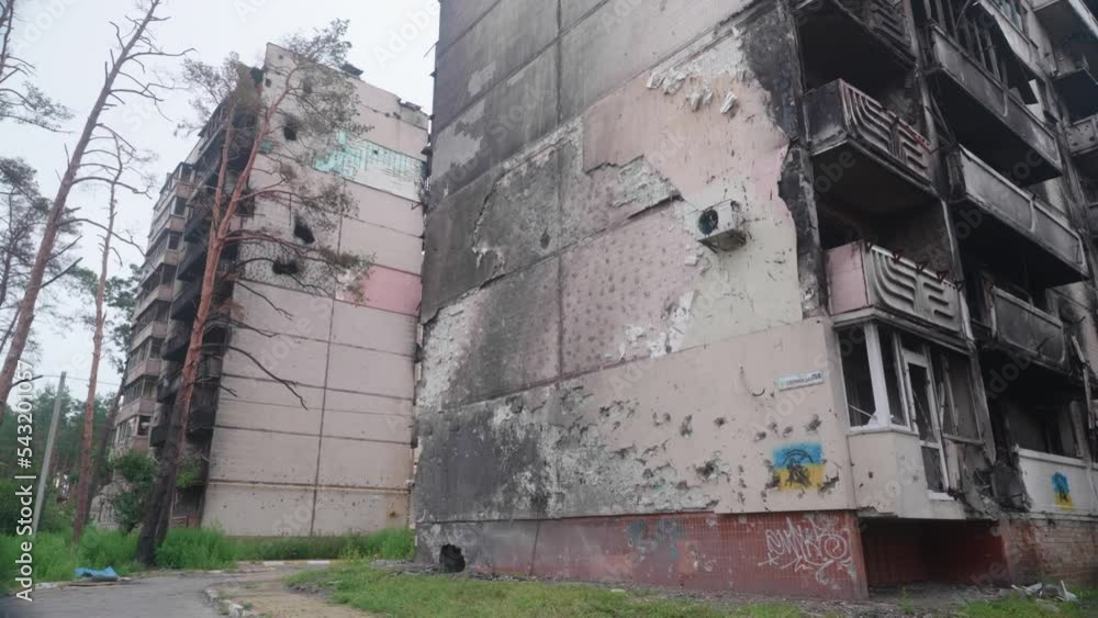 Low-angle view of bombed residential building, destroyed and burned ...