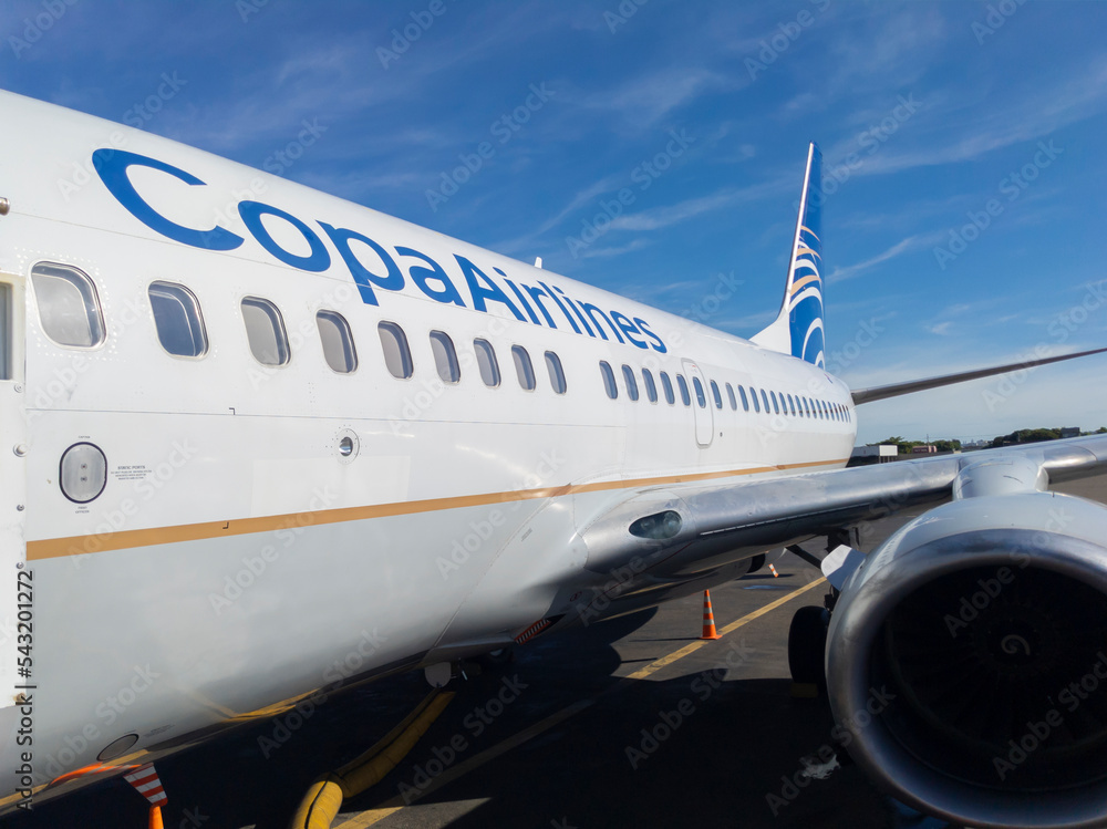 Sign Copa Airlines and it's logo on the side of the airplane's fuselage ...