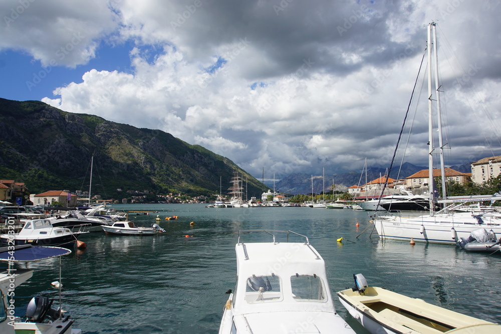 Kotor port, boats in Kotor bay, marina, kotor old town city walls ...