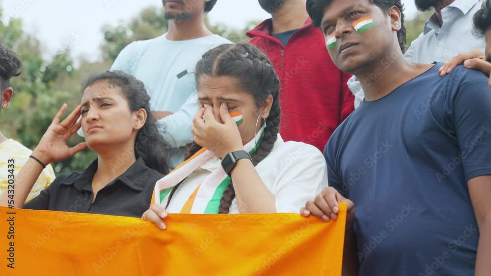 Worried sad girls with Indian flag in hand due to loss of match while ...