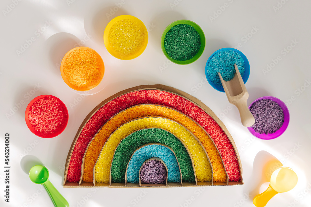 Rainbow filled with bright colored rice. Sensory bin for busy toddler ...