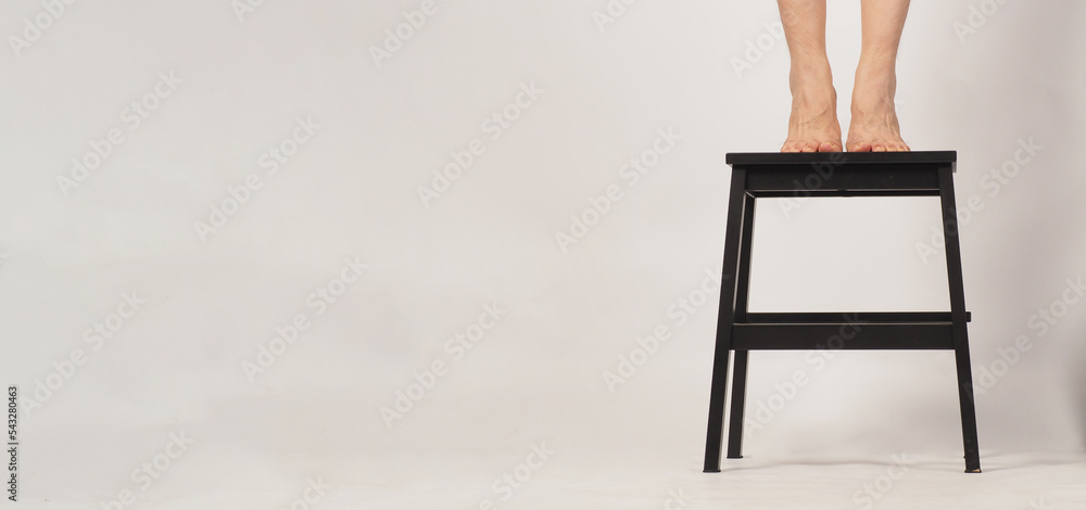 Legs and Barefoot stand on a step stool on white background. Stock ...