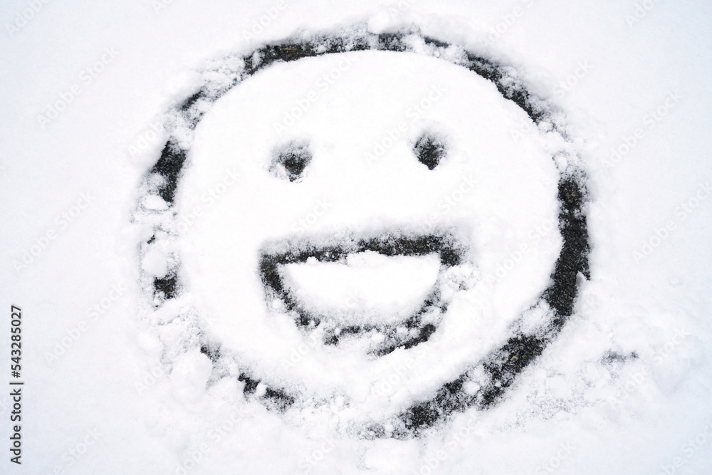 drawn smile face on the snow Stock Photo | Adobe Stock