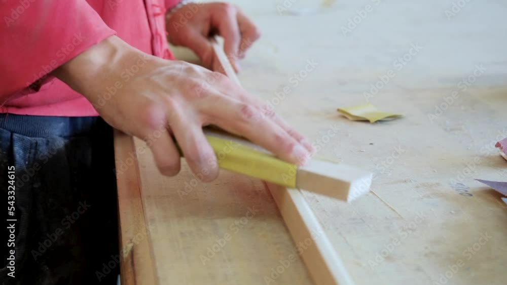 Processing of a furniture part by a machine for polishing a tree. the ...