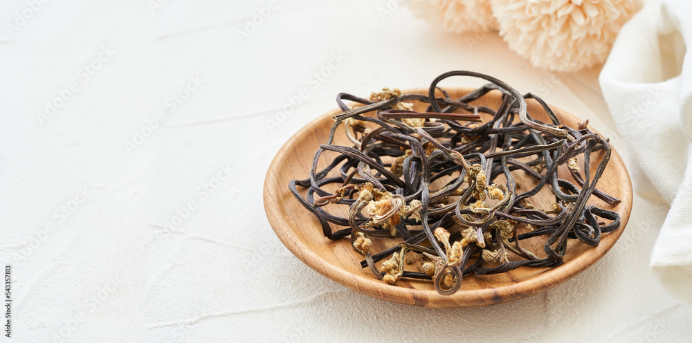 Korean dried bracken or fernbrake Gosari in wood plate on white table ...