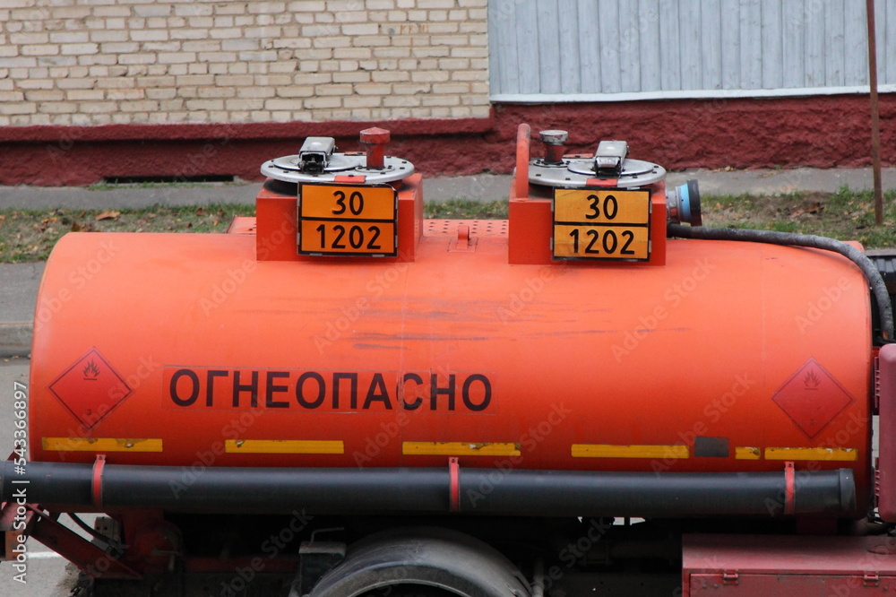 Orange diesel barrel on truck fuel tanker with 30 1202 dangerous class ...