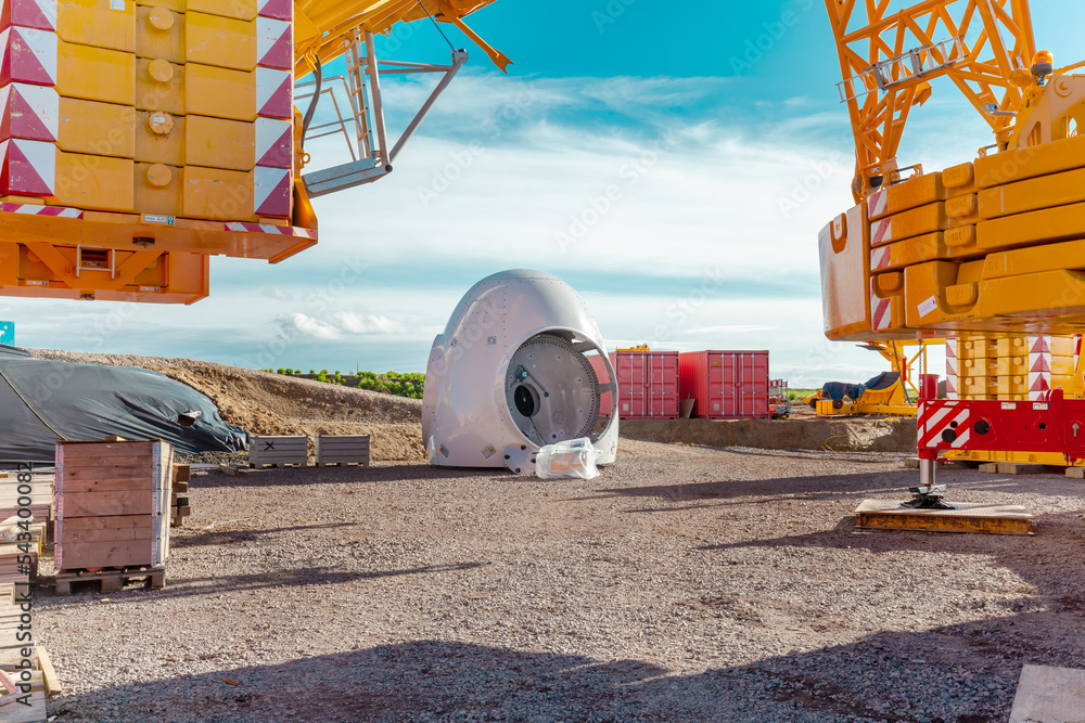 Building and assembling a construction windturbine by crane. Rotor ...