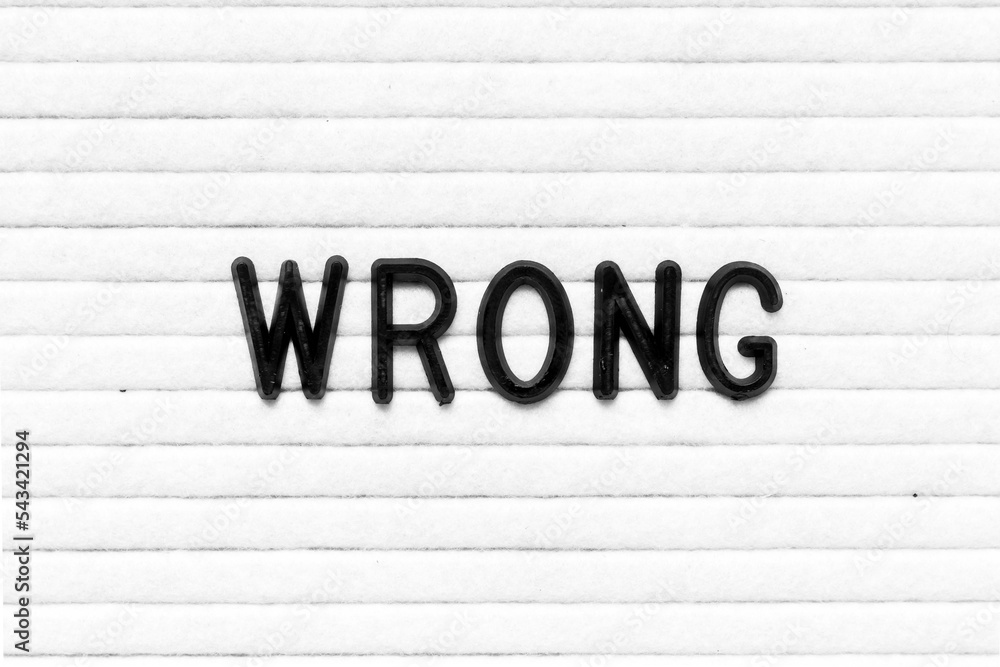 Black color letter in word wrong on white felt board background Stock ...