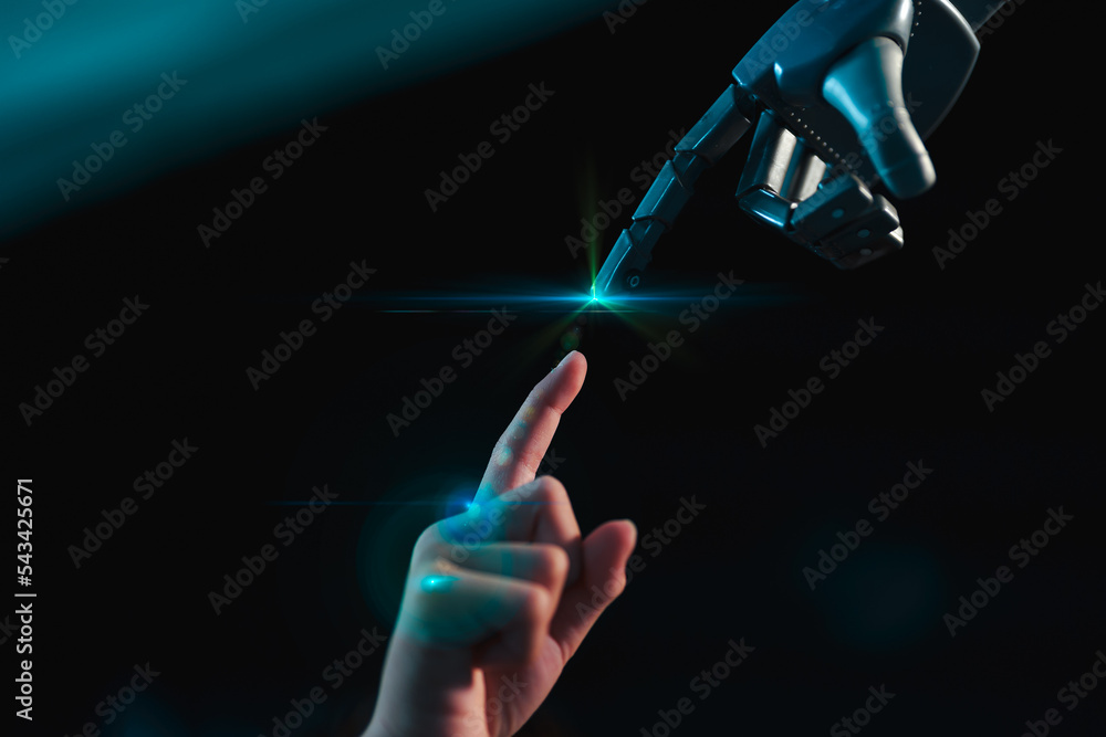 Portrait Boy holding his finger to touch robotics arm finger for STEM ...