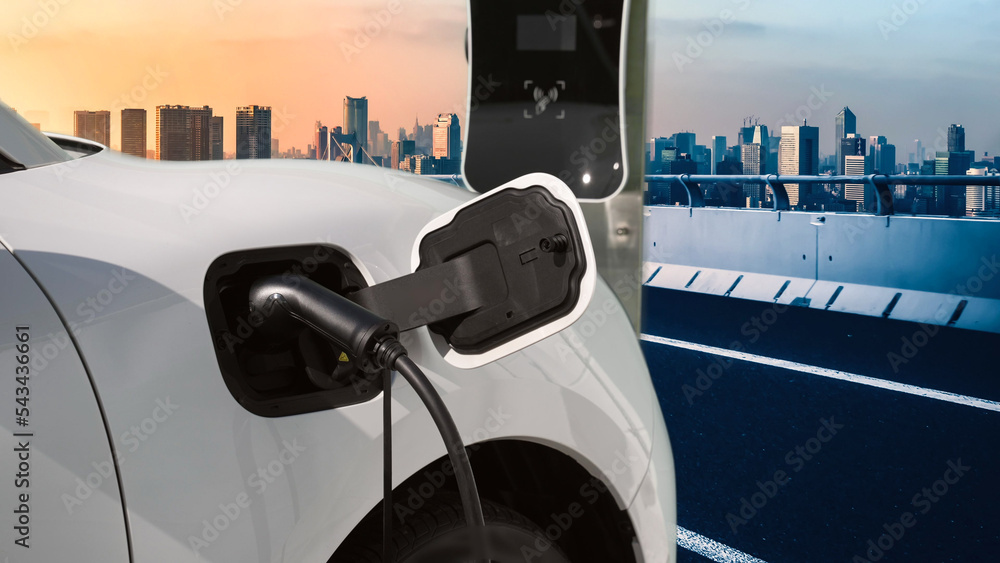 Electric vehicle, EV car recharges battery energy at charging station ...