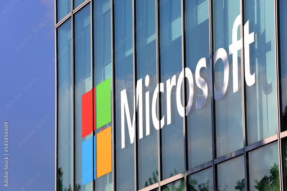 Logo of Microsoft company headquarters is photographed on a office ...