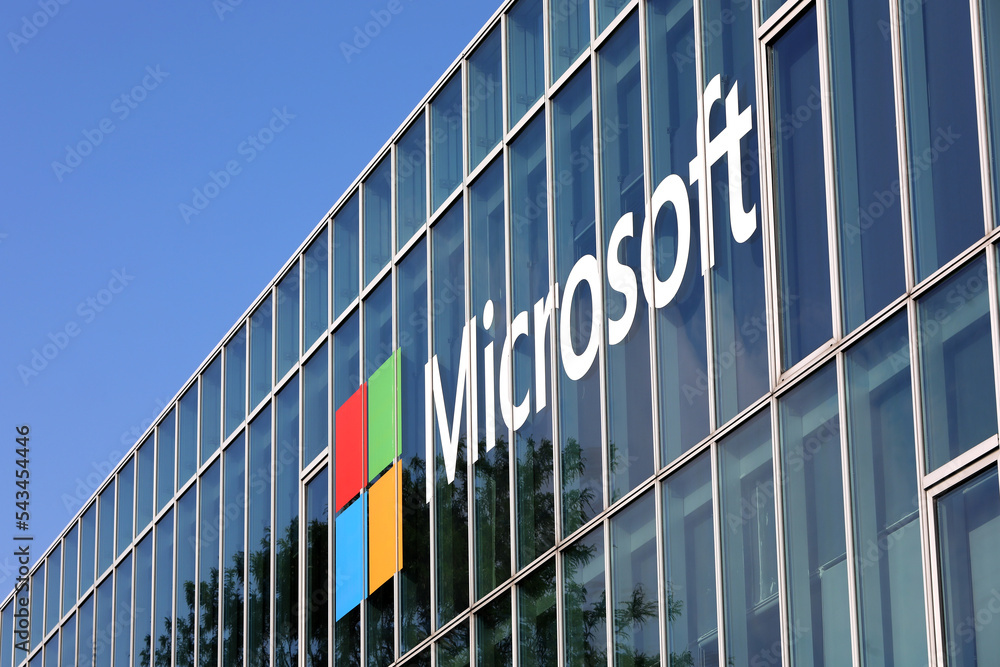 Logo of Microsoft company headquarters is photographed on a office ...