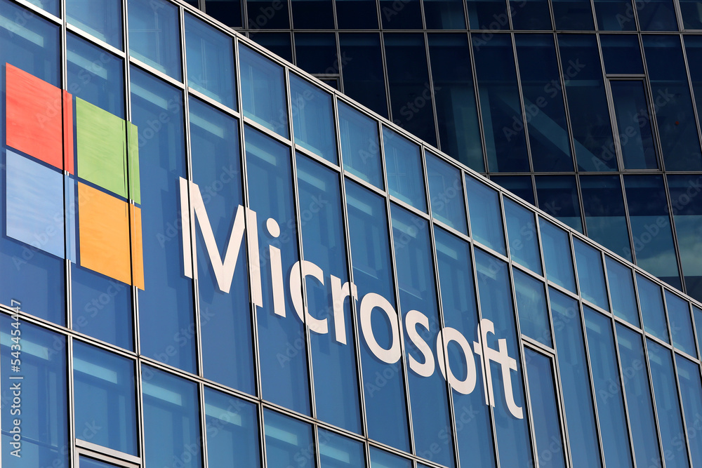 Logo of Microsoft company headquarters is photographed on a office ...