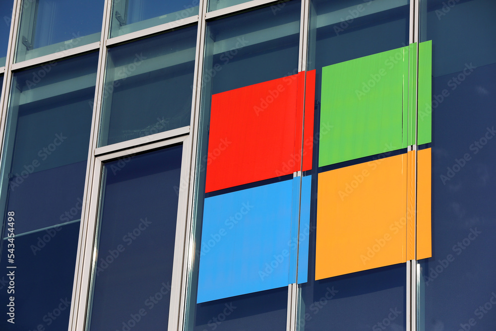 Logo of Microsoft company headquarters is photographed on a office ...
