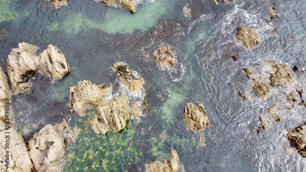Aerial photo. A lot of boulders in the sea water, top view. Coastal ...