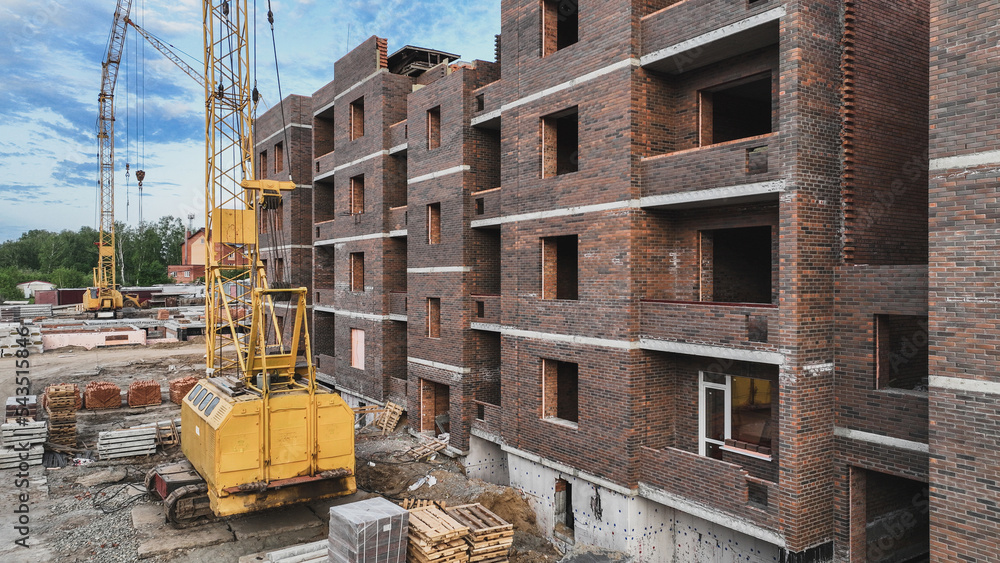 Construction site of low-rise brick houses in summer time Stock Photo ...