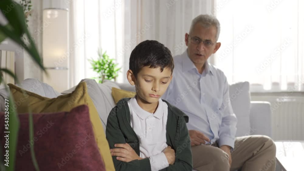 Nervous father shouting at home and scolding his son. Nervous father ...