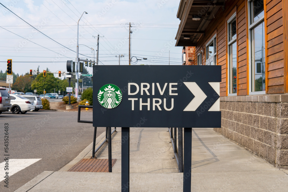 Drive Thru Starbucks Coffee Sign with Logo at Starbucks coffee shop ...