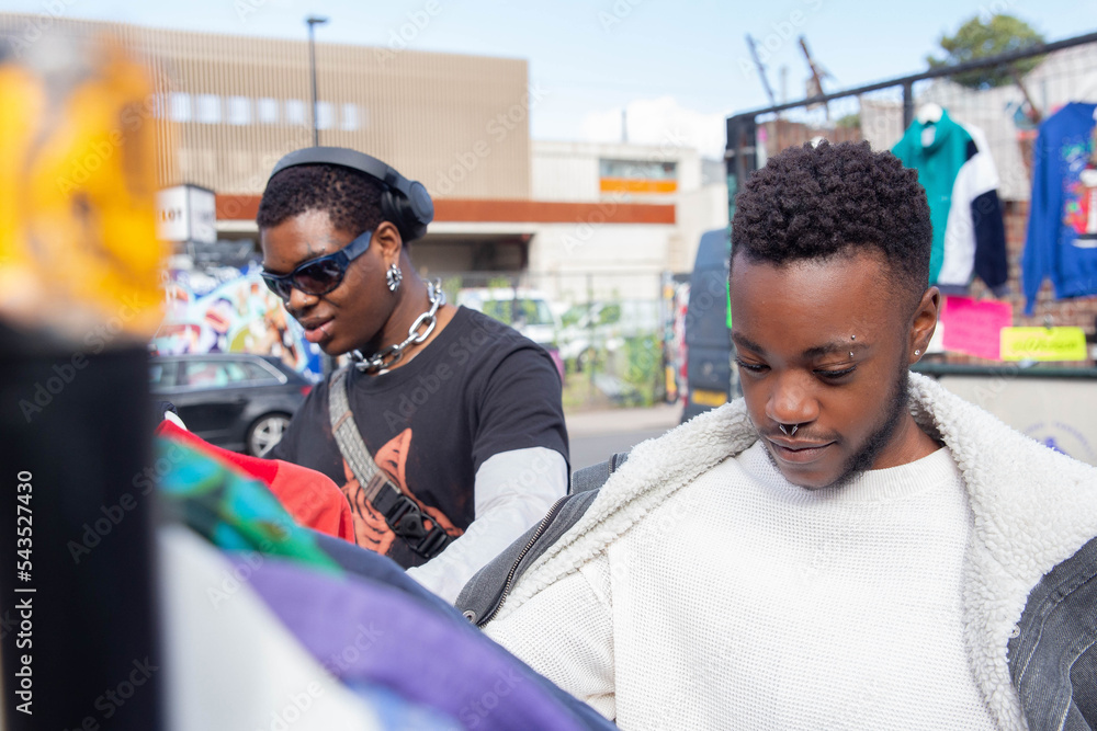 Two black transgender friends at a vintage market. Stock Photo | Adobe ...