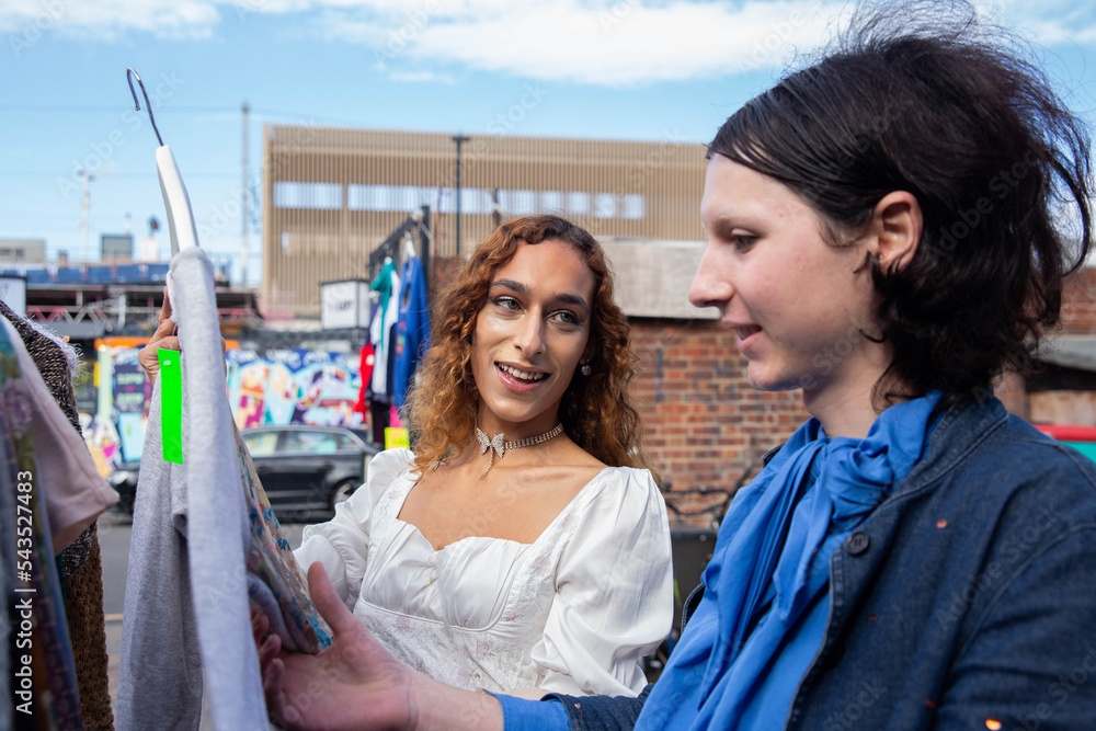 Two transgender friends at a vintage market. Stock-Foto | Adobe Stock