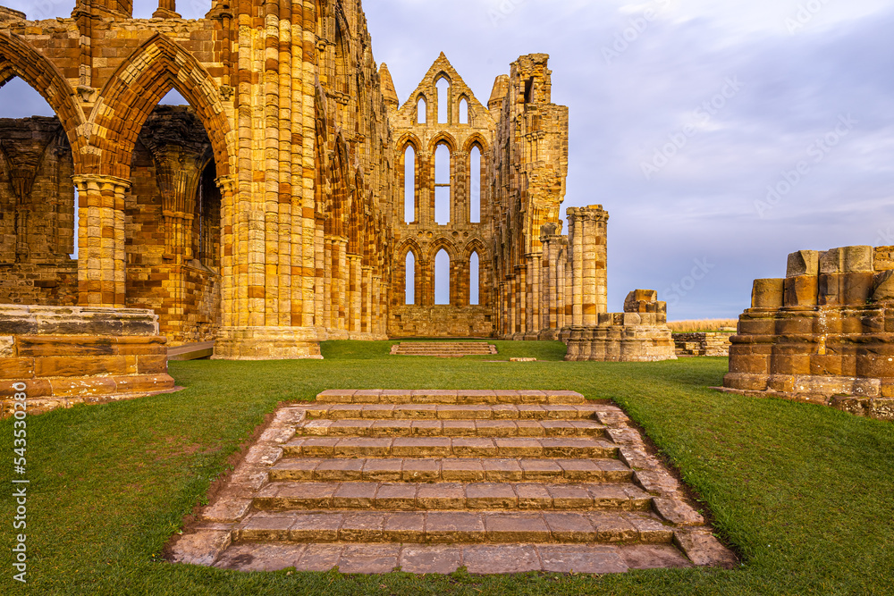Sunset view of Whitby abbey overlooking the North Sea on the East Cliff ...