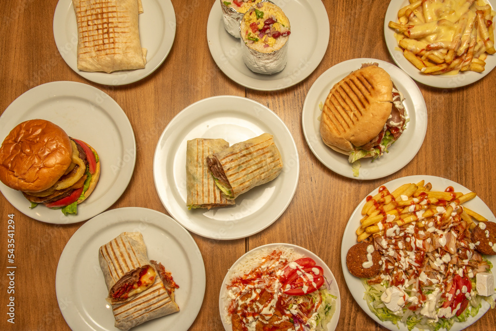 Set of fast food dishes with hamburgers, burritos and durum and kebab ...