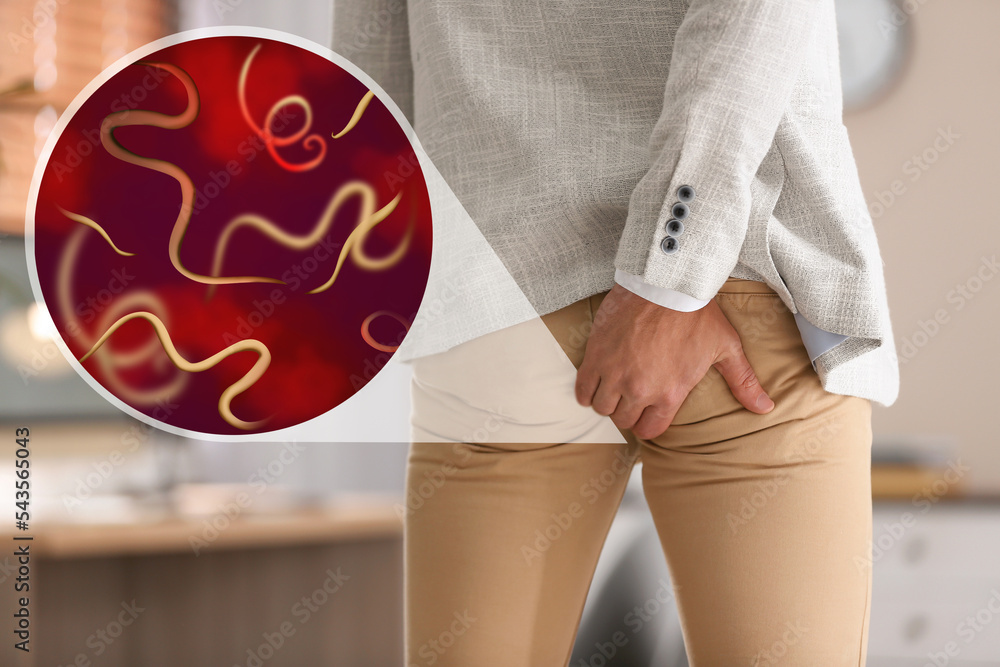 Parasites under microscope and man suffering from helminthiasis ...