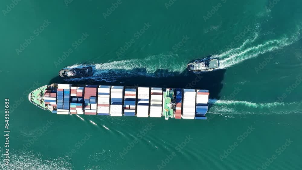 Vídeo do Stock: Container cargo ship was dragged by tug boat to ...