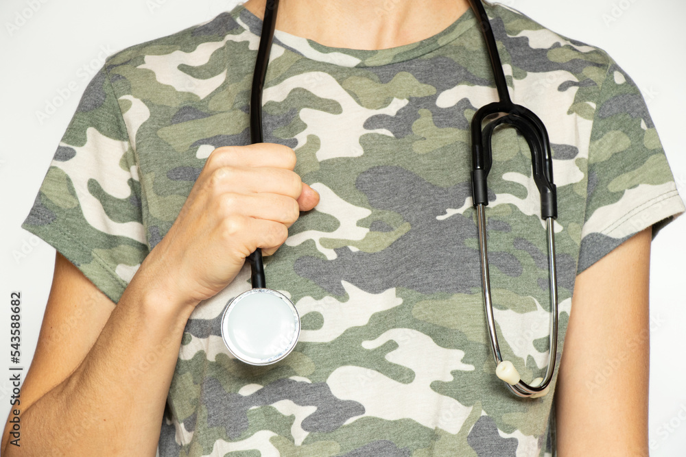 Military nurse with stethoscope over isolated background , military ...