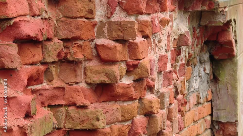 Ancient weathered brick wall with cracks and destroyed stucco layer ...